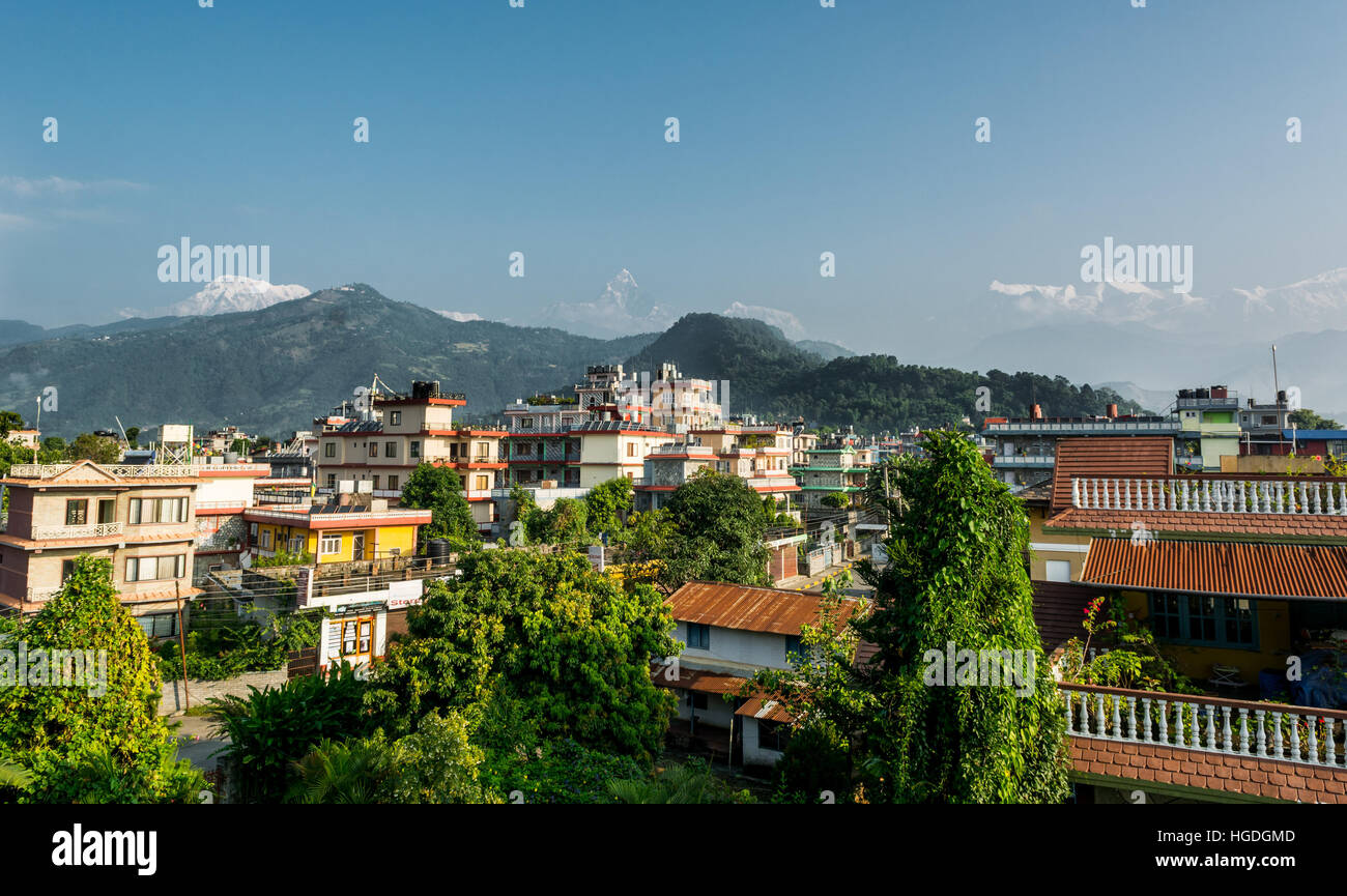 Rooftop view of mountains rising in distance Stock Photo - Alamy