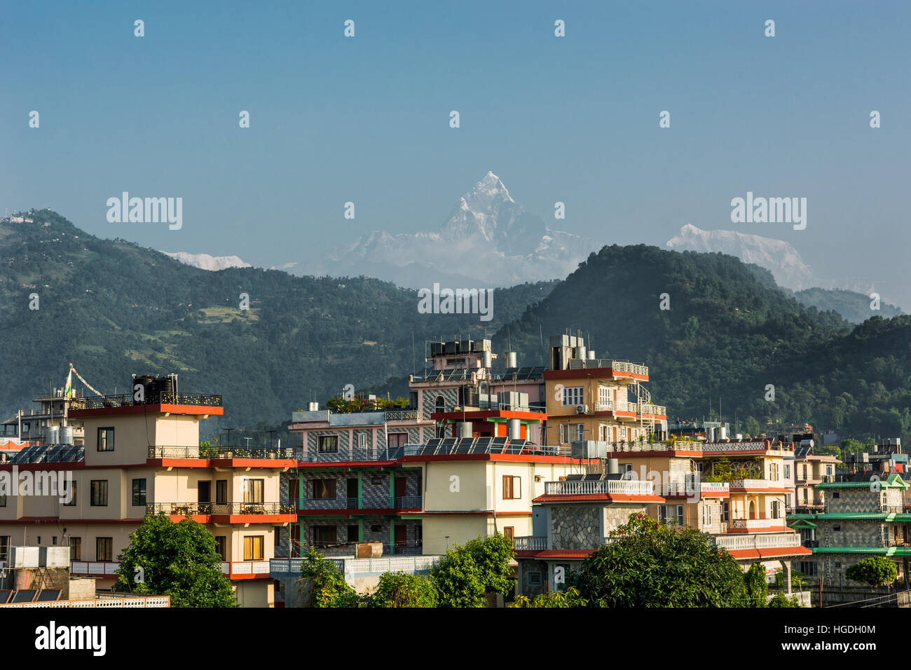 Rooftop view of mountains rising in distance Stock Photo - Alamy