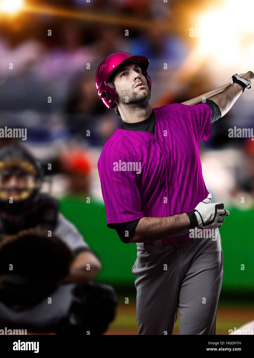 Baseball Player with a pink uniform on baseball Stadium Stock Photo - Alamy