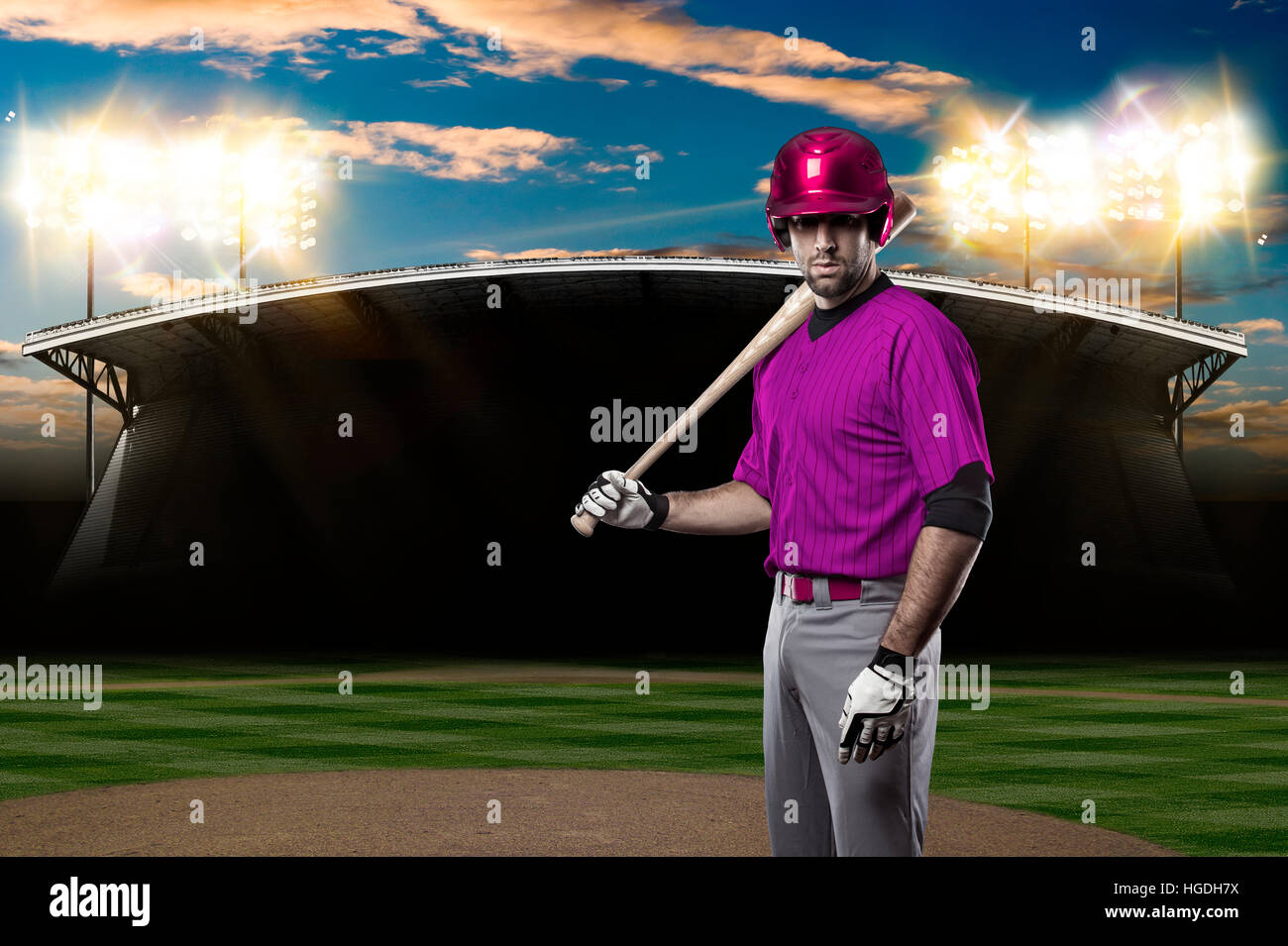 Baseball Player with a pink uniform on baseball Stadium Stock Photo - Alamy