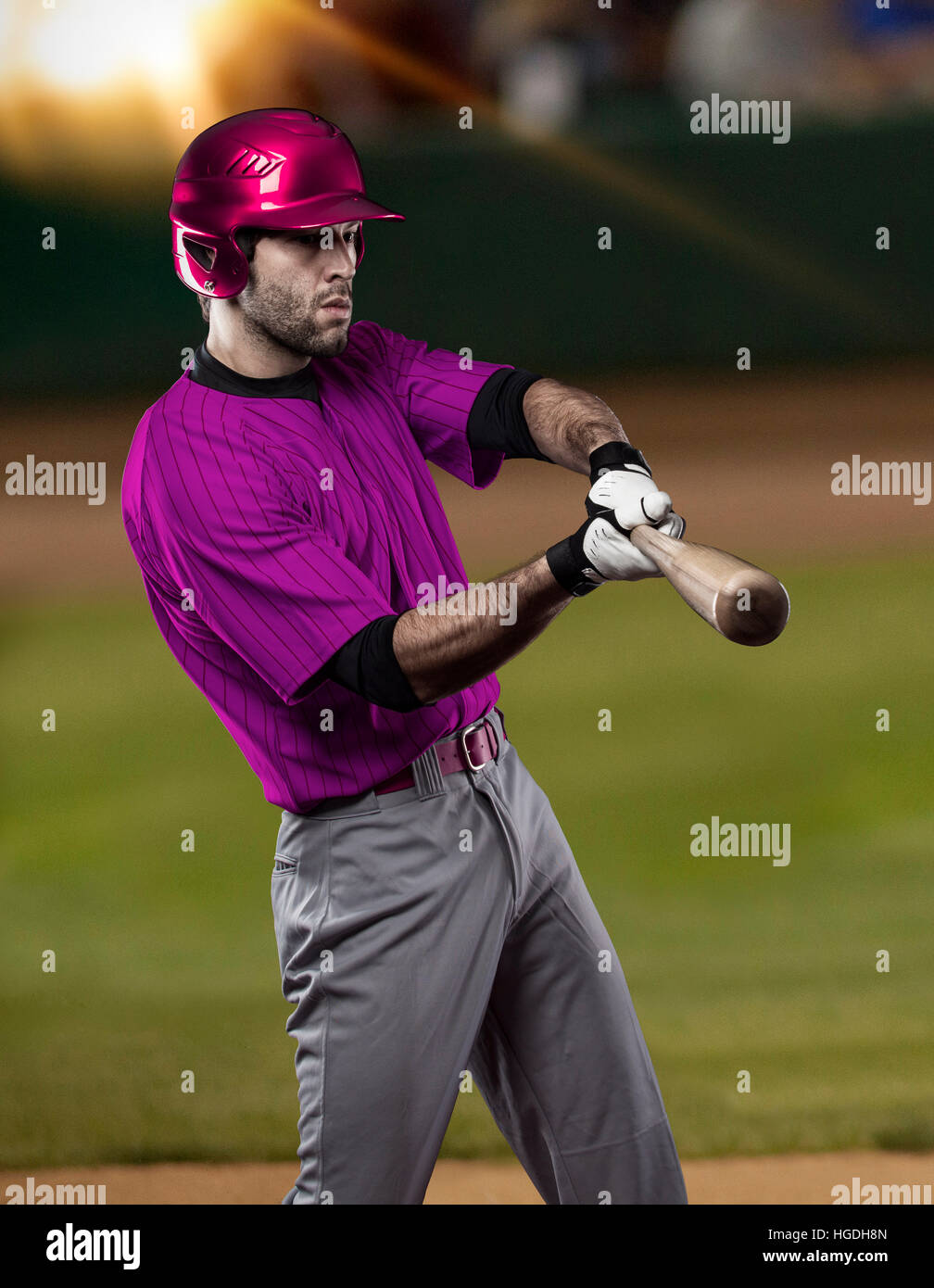 Baseball Player with a pink uniform on baseball Stadium Stock Photo - Alamy