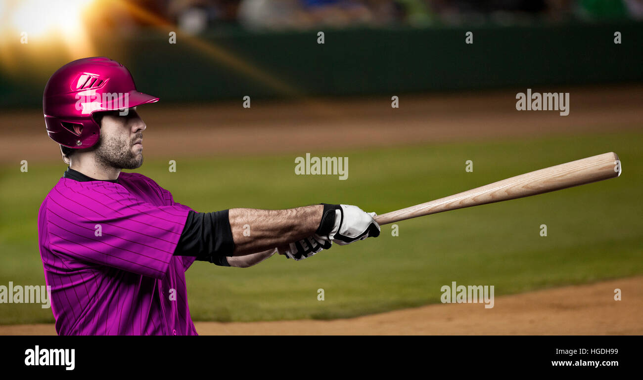 Baseball Player with a pink uniform on baseball Stadium Stock Photo - Alamy