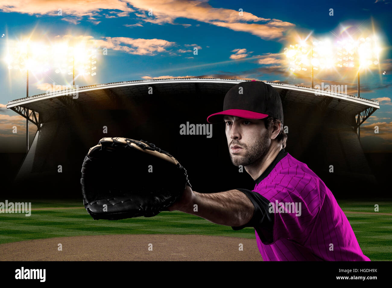 Baseball Player with a pink uniform on baseball Stadium Stock Photo - Alamy