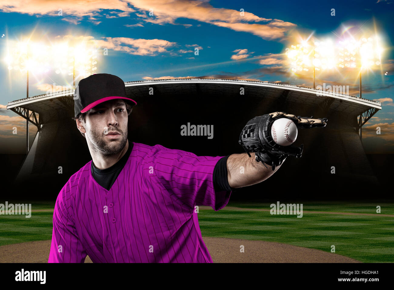 Baseball Player with a pink uniform on baseball Stadium Stock Photo - Alamy