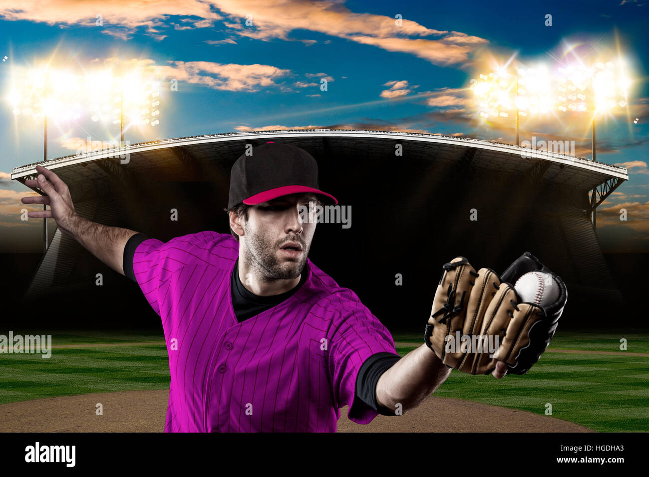 Baseball Player with a pink uniform on baseball Stadium Stock Photo - Alamy