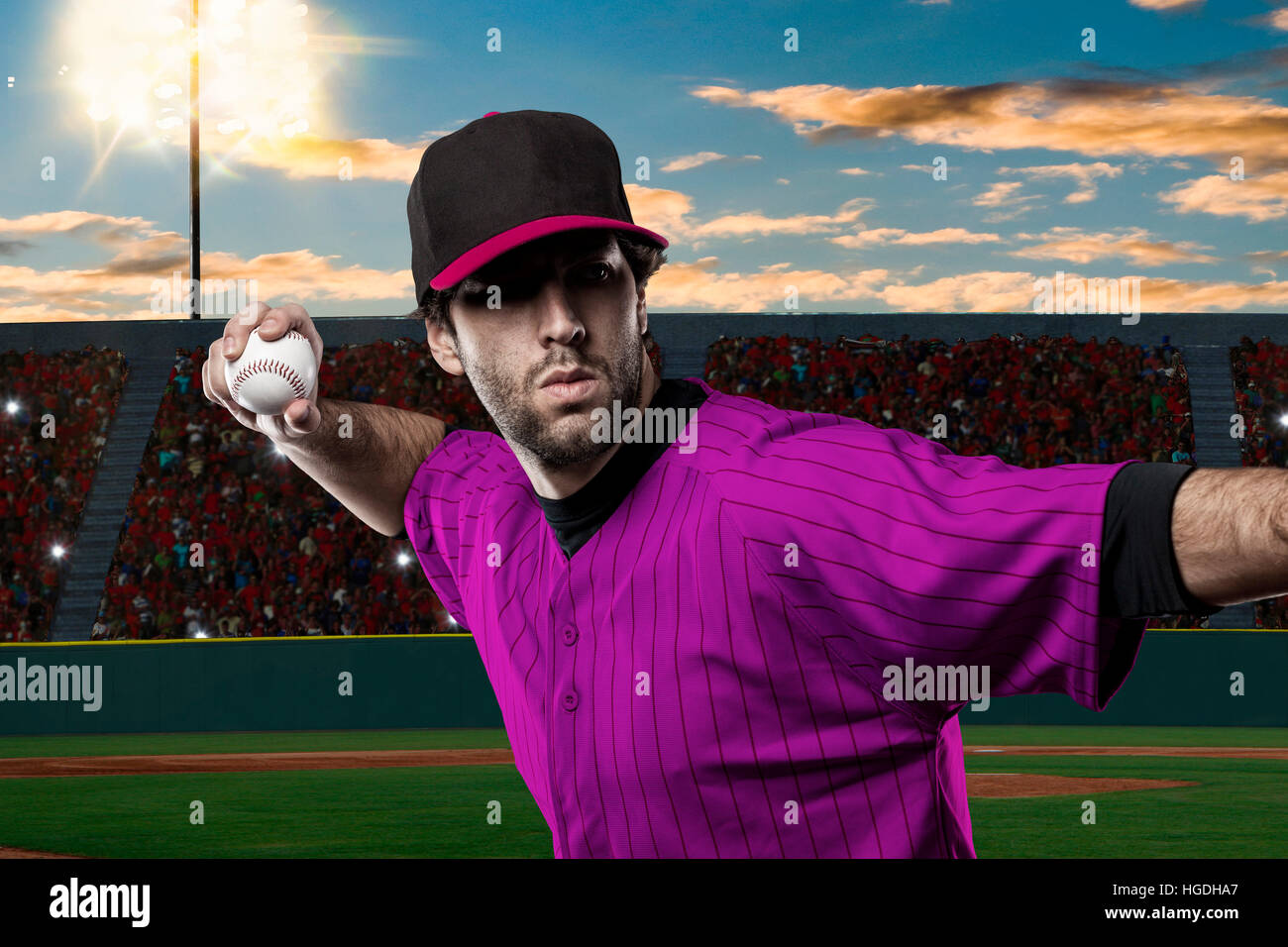 Baseball Player with a pink uniform on baseball Stadium Stock Photo - Alamy