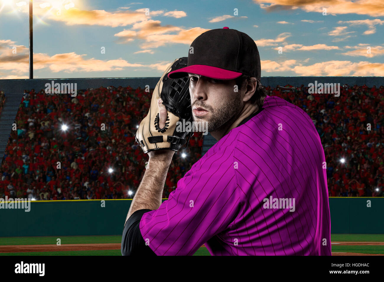 Pitcher Baseball Player with a pink uniform on baseball Stadium Stock ...