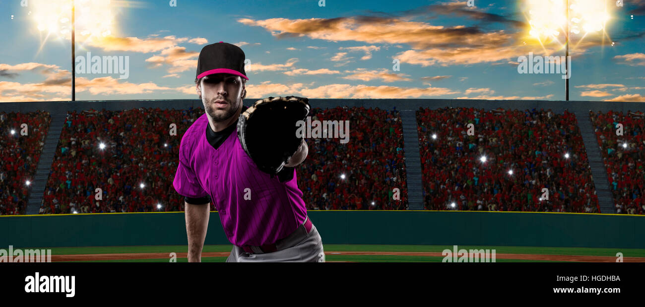 Baseball Player with a pink uniform on baseball Stadium Stock Photo - Alamy