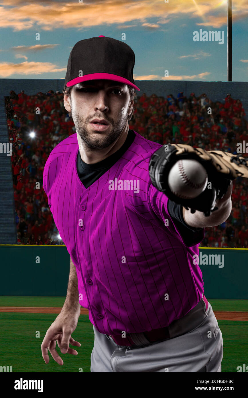 Baseball Player with a pink uniform on baseball Stadium Stock Photo - Alamy