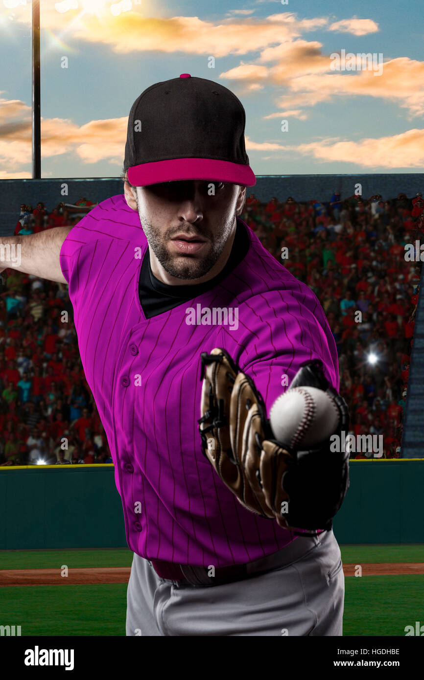 Baseball Player with a pink uniform on baseball Stadium Stock Photo - Alamy