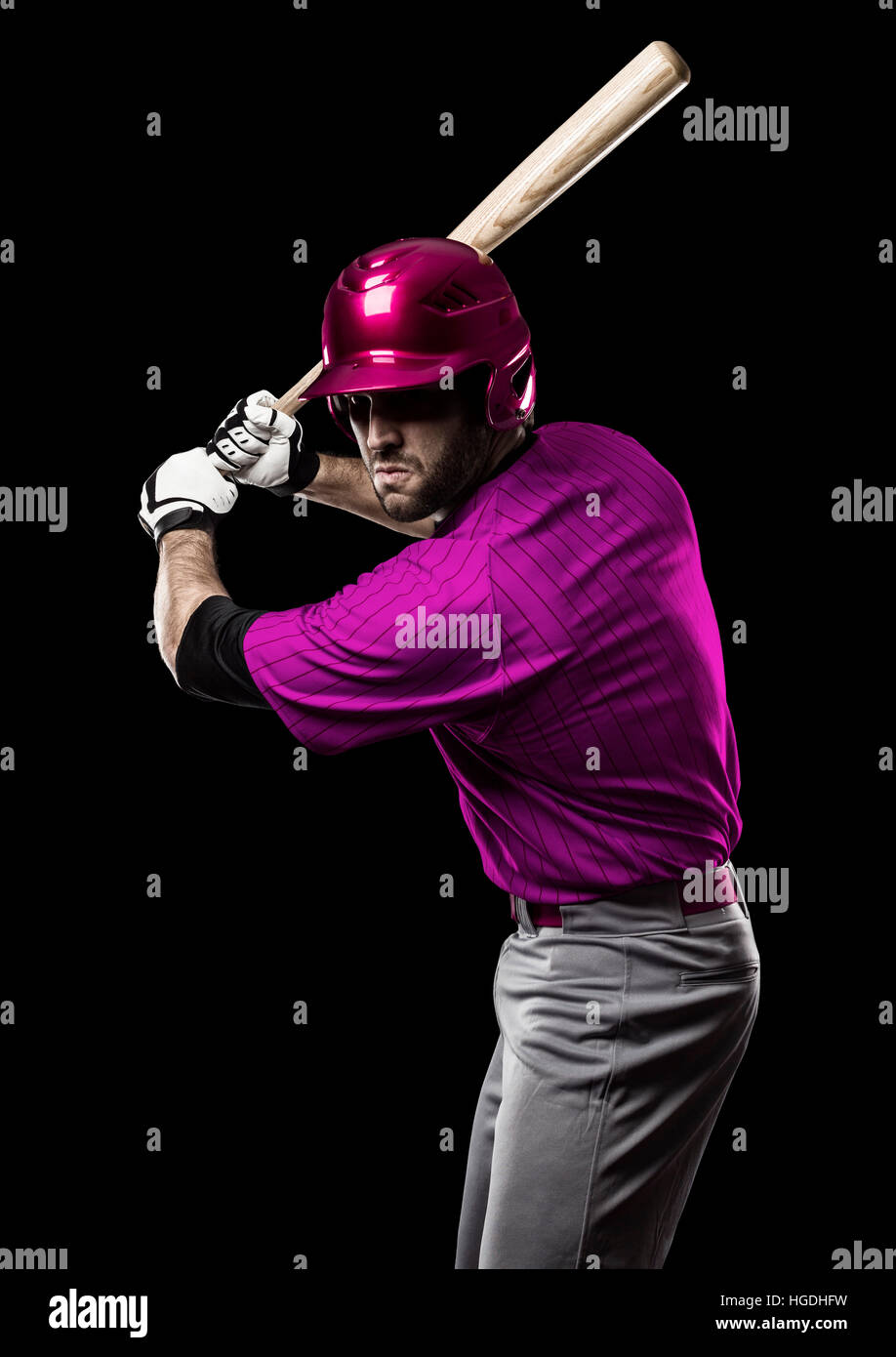 Baseball Player with a pink uniform on a black background Stock Photo ...