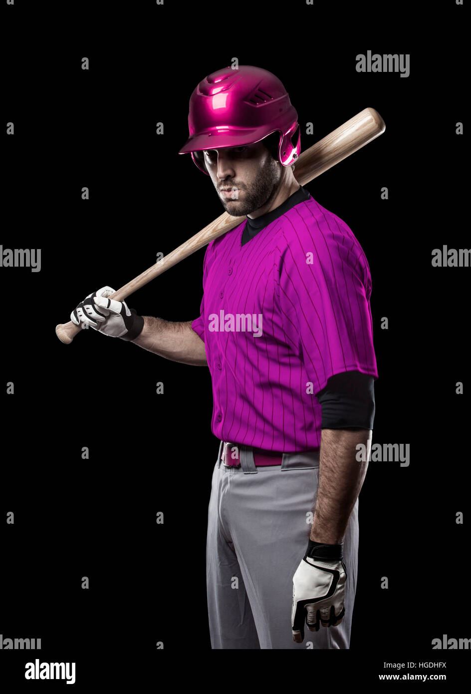 Baseball Player with a pink uniform on a black background Stock Photo ...