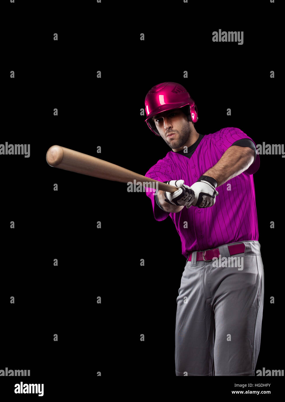 Baseball Player with a pink uniform on a black background Stock Photo ...