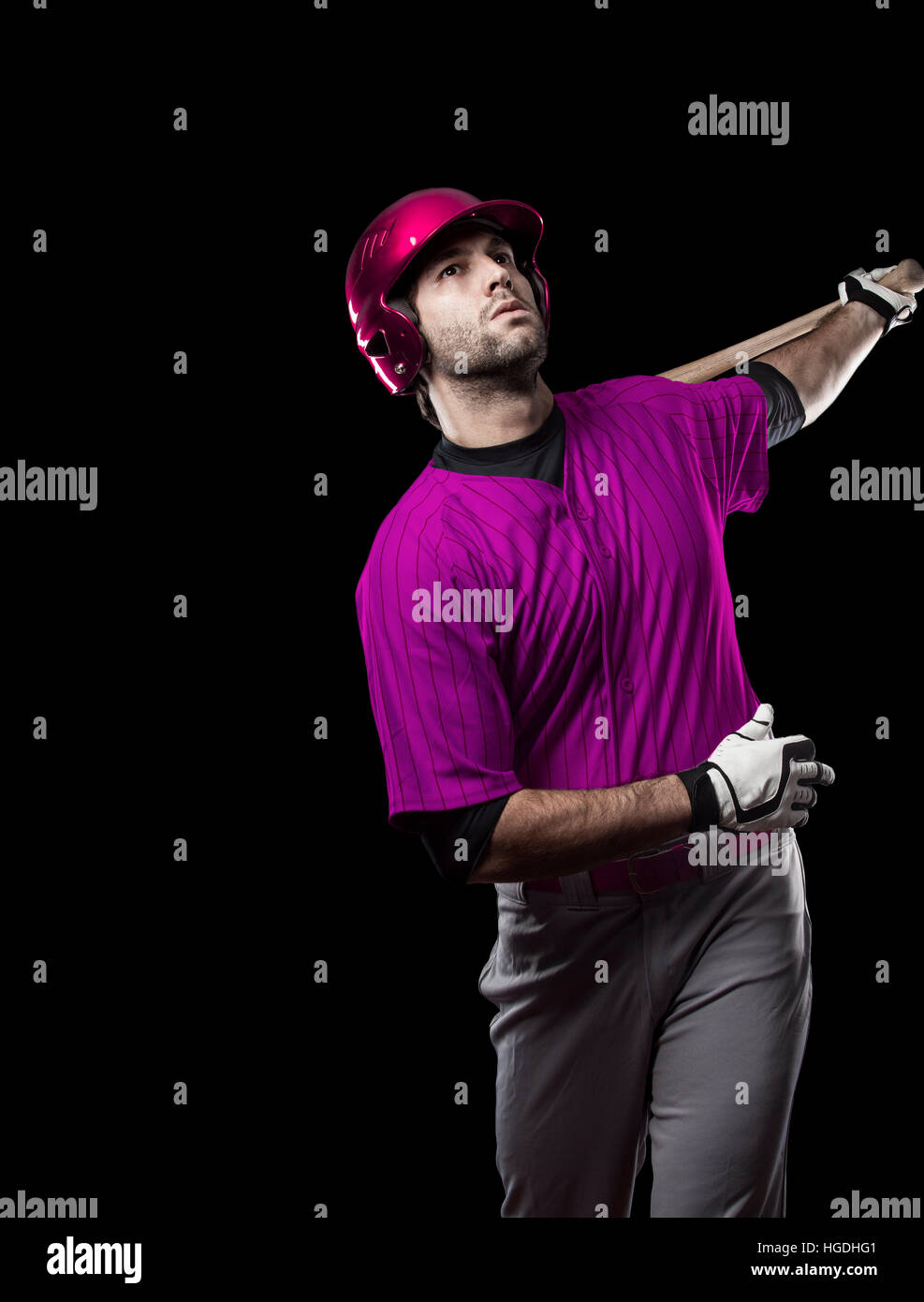 Baseball Player with a pink uniform on a black background Stock Photo ...