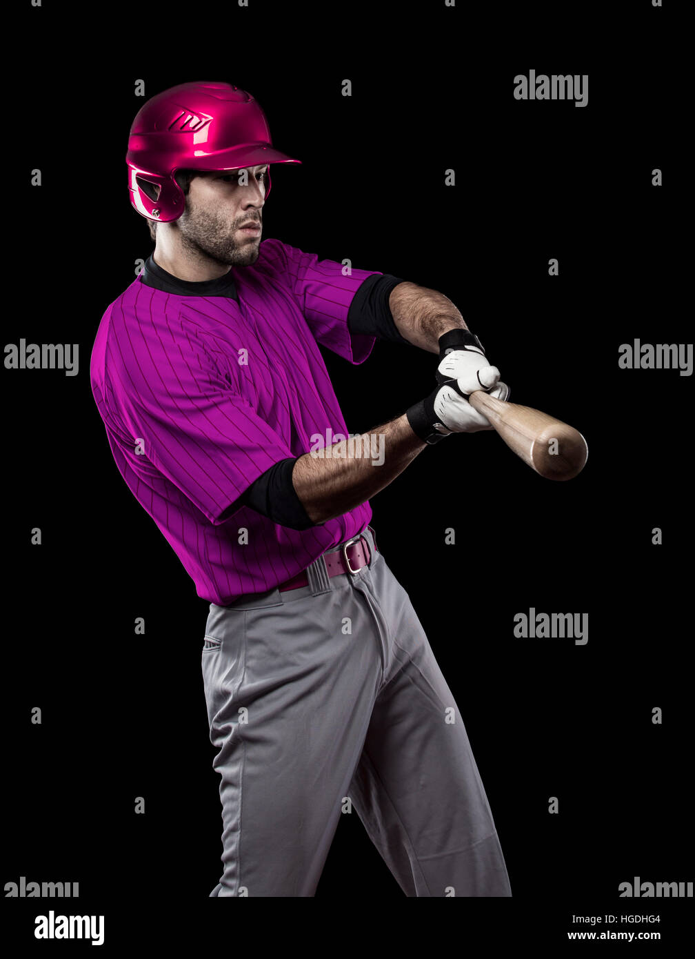 Baseball Player with a pink uniform on a black background Stock Photo ...