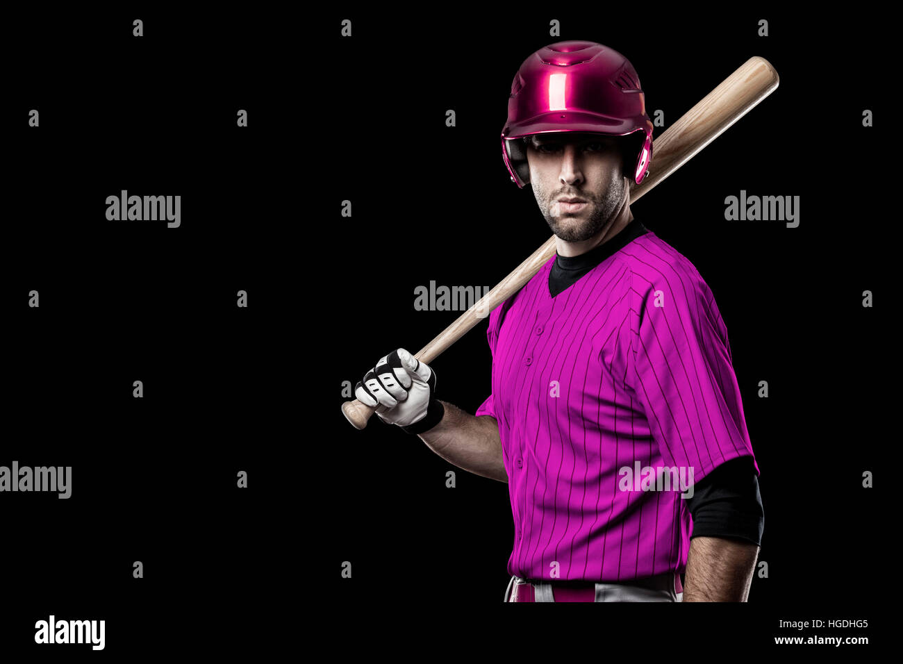 Baseball Player with a pink uniform on a black background Stock Photo ...
