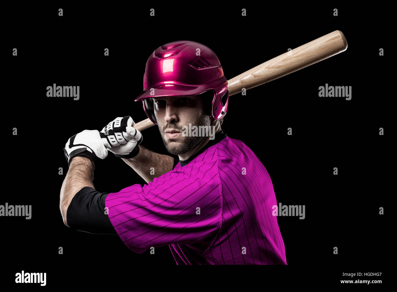 Baseball Player with a pink uniform on a black background Stock Photo ...