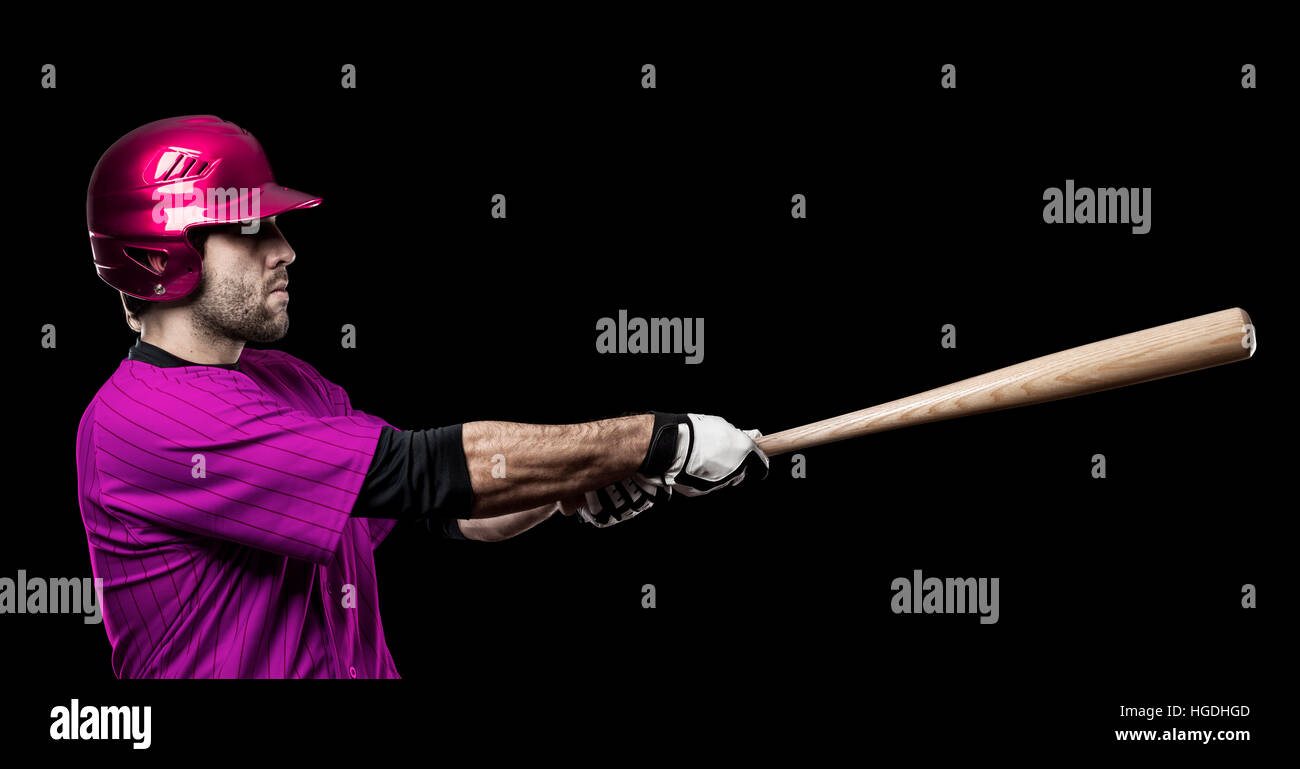 Baseball Player with a pink uniform on a black background Stock Photo ...