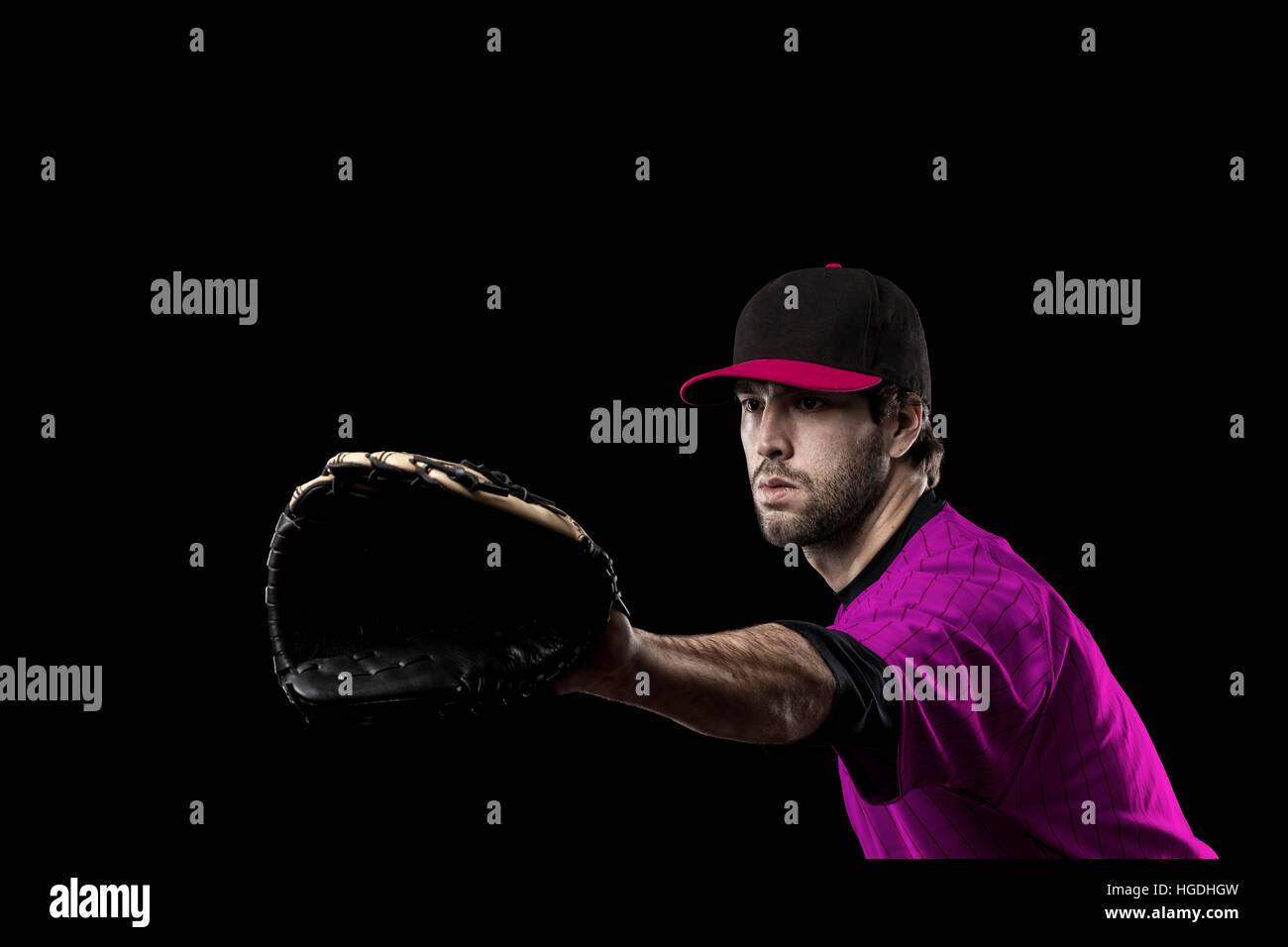 Baseball Player with a pink uniform on a black background Stock Photo ...