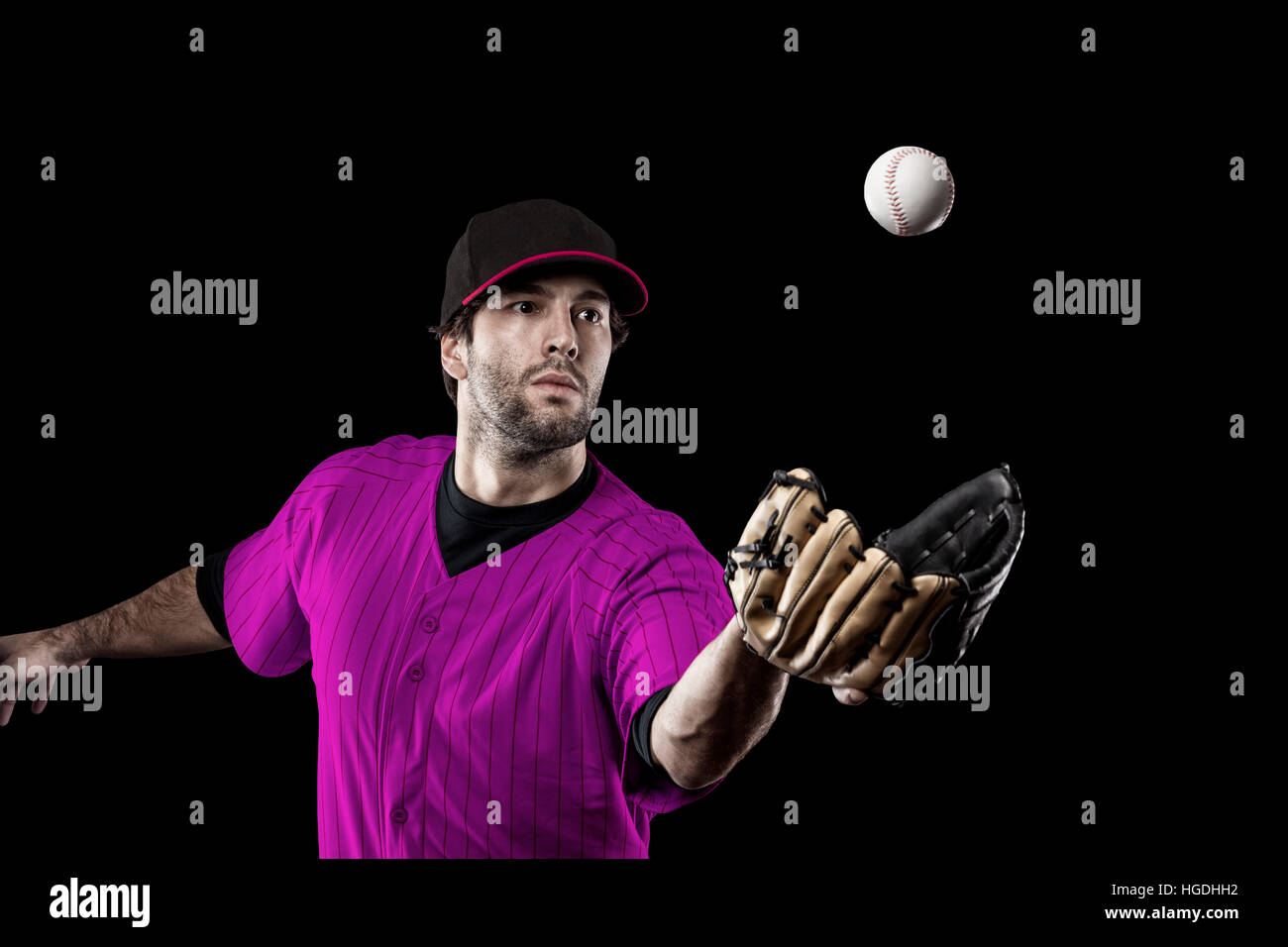 Baseball Player with a pink uniform on a black background Stock Photo ...
