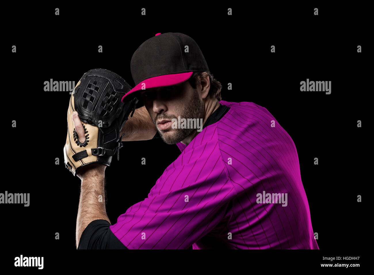 Baseball Player with a pink uniform on a black background Stock Photo ...