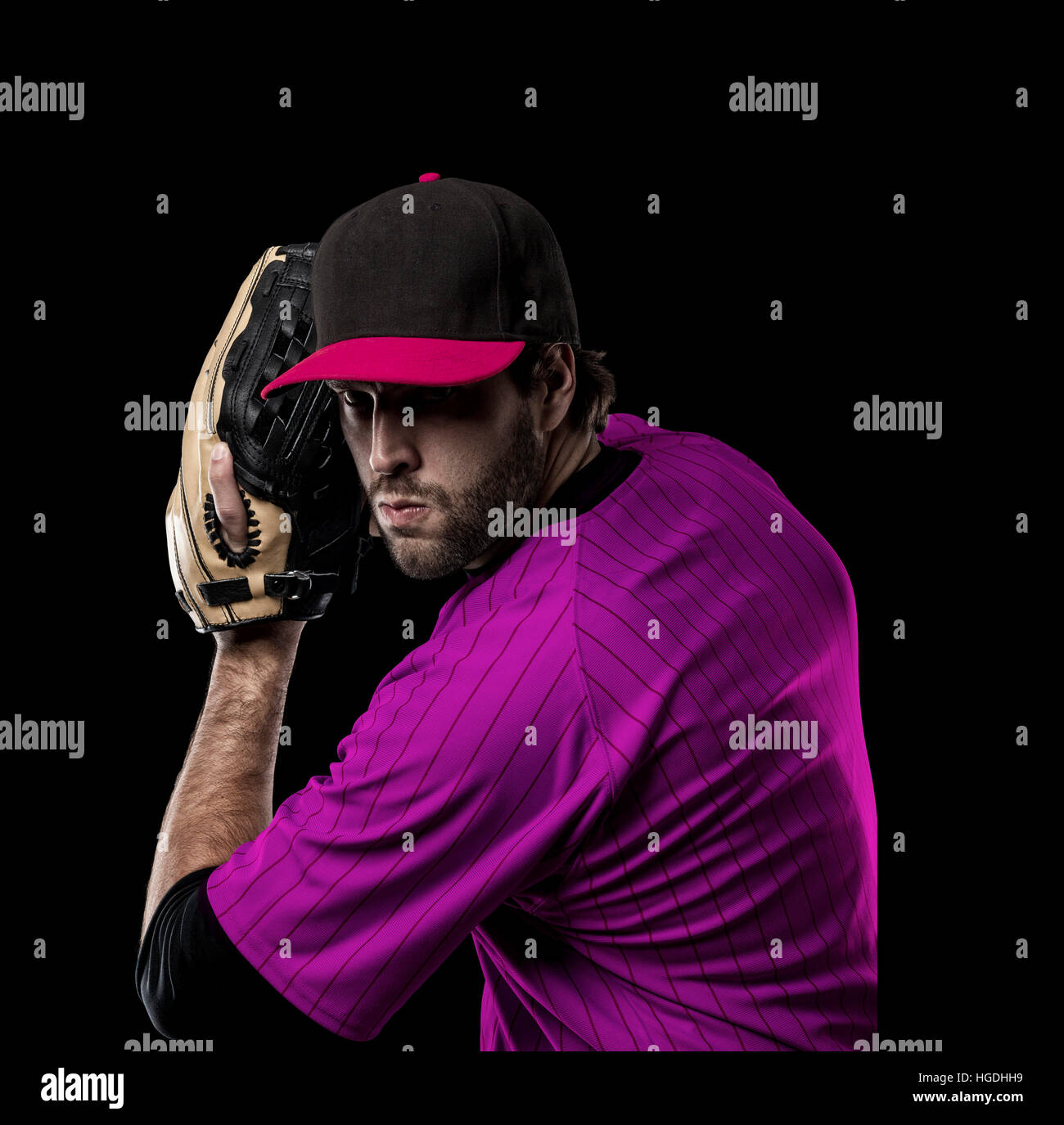 Pitcher Baseball Player with a pink uniform on a black background Stock ...