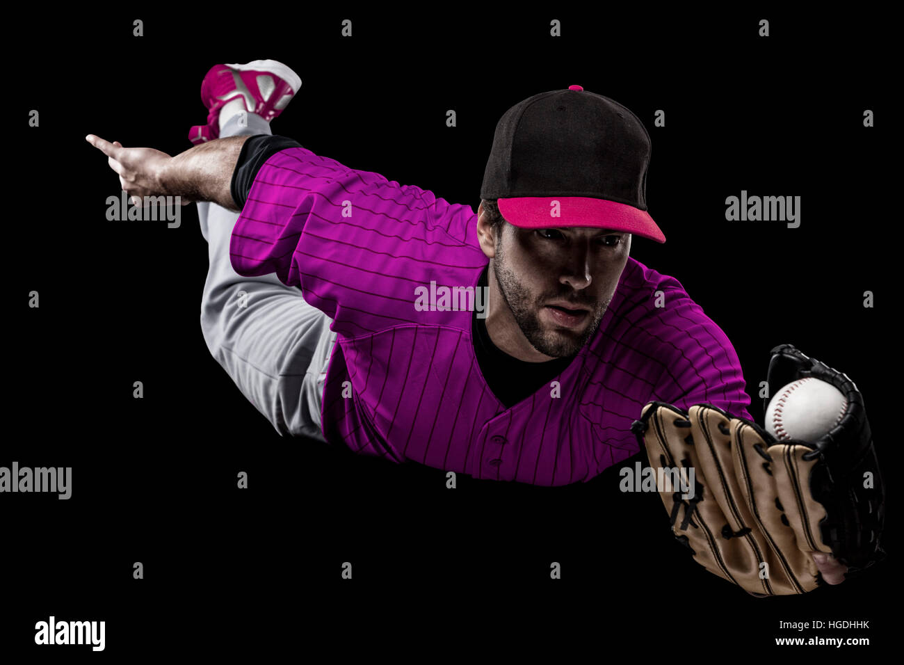 Baseball Player with a pink uniform on a black background Stock Photo ...
