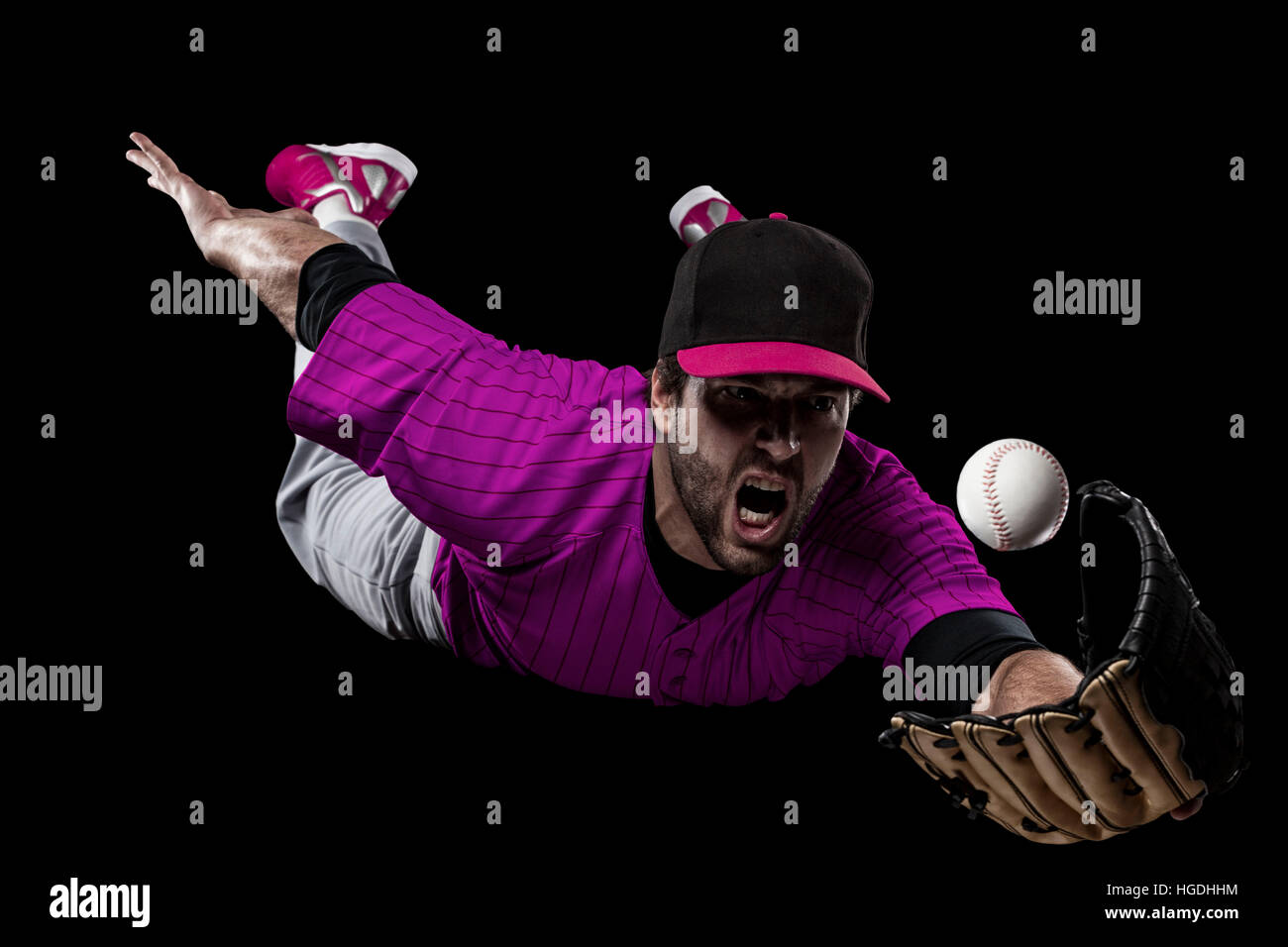 Baseball Player with a pink uniform on a black background Stock Photo ...