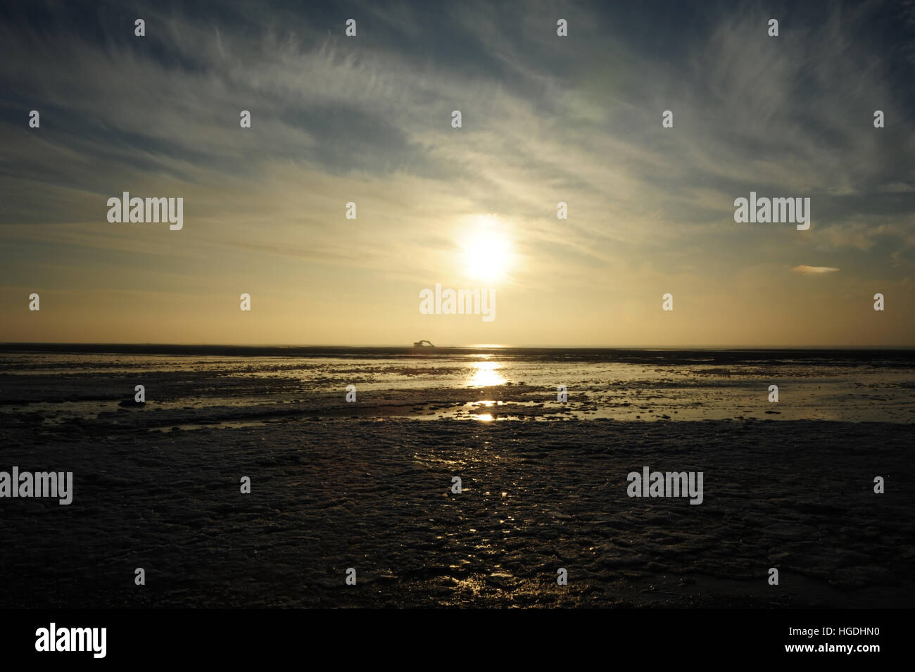 1 sand winning sand extraction digger standing beach centre background ...