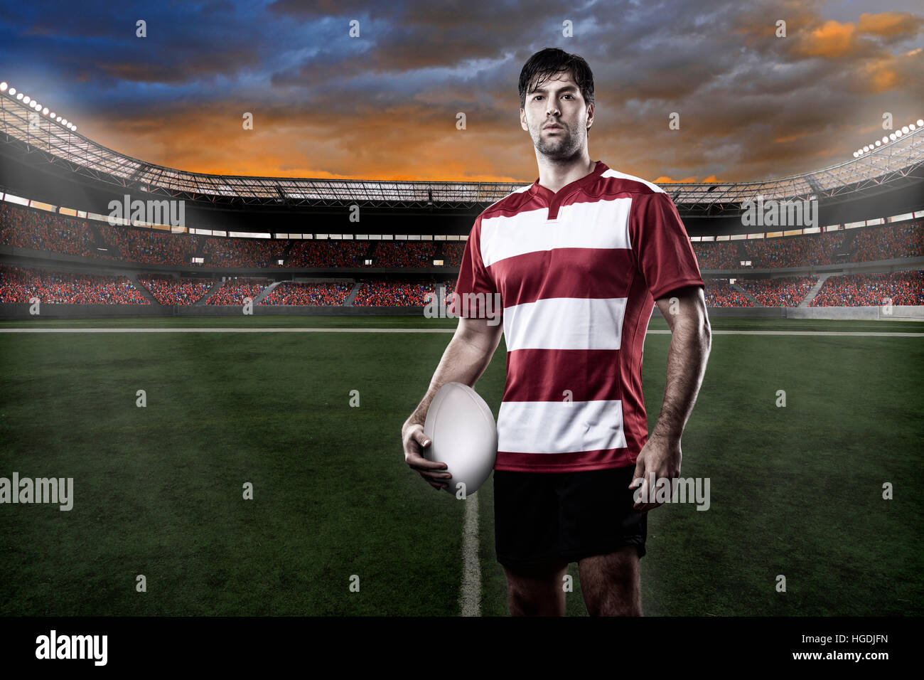 Rugby player in a red uniform. White Background Stock Photo - Alamy