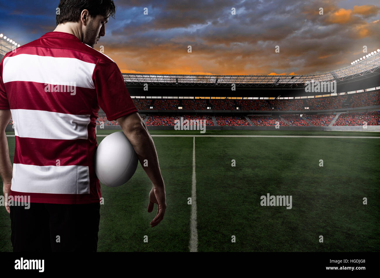 Rugby player in a red uniform. White Background Stock Photo - Alamy