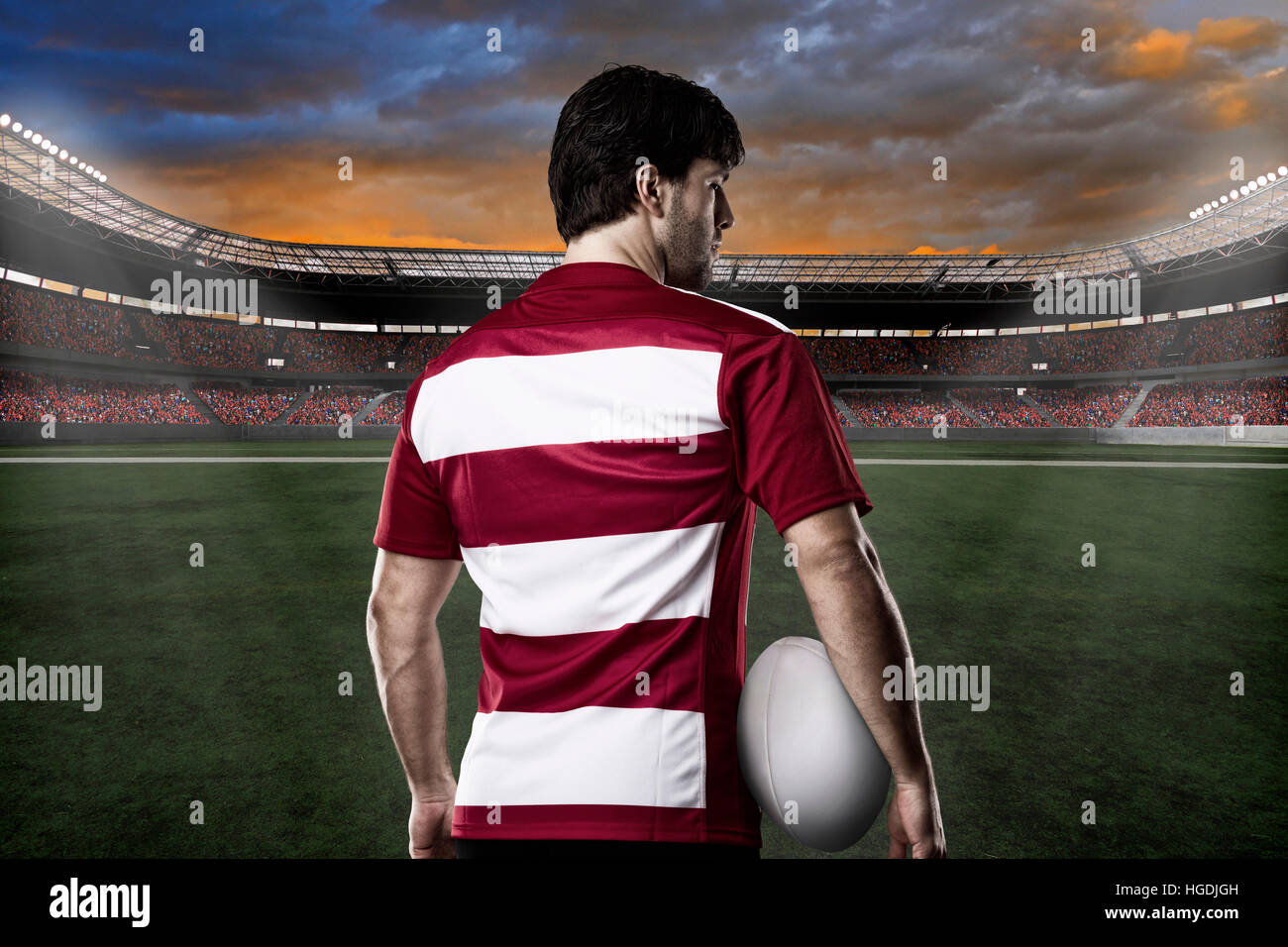 Rugby player in a red uniform. White Background Stock Photo - Alamy
