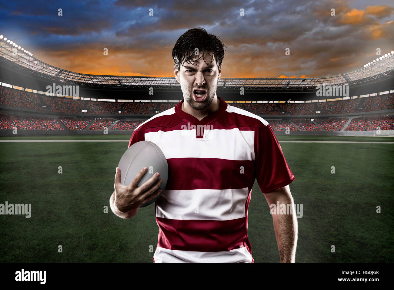 Rugby player in a red uniform. White Background Stock Photo - Alamy
