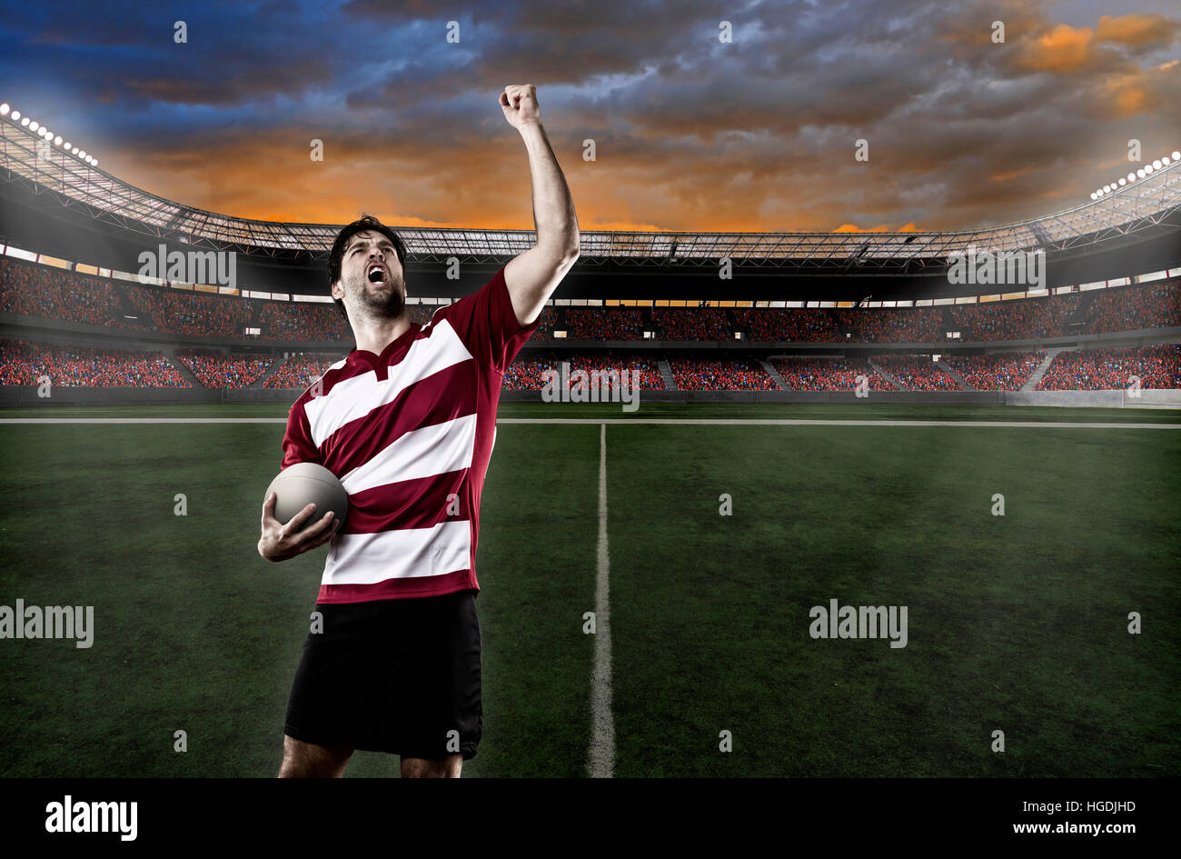 Rugby player in a red uniform. White Background Stock Photo - Alamy