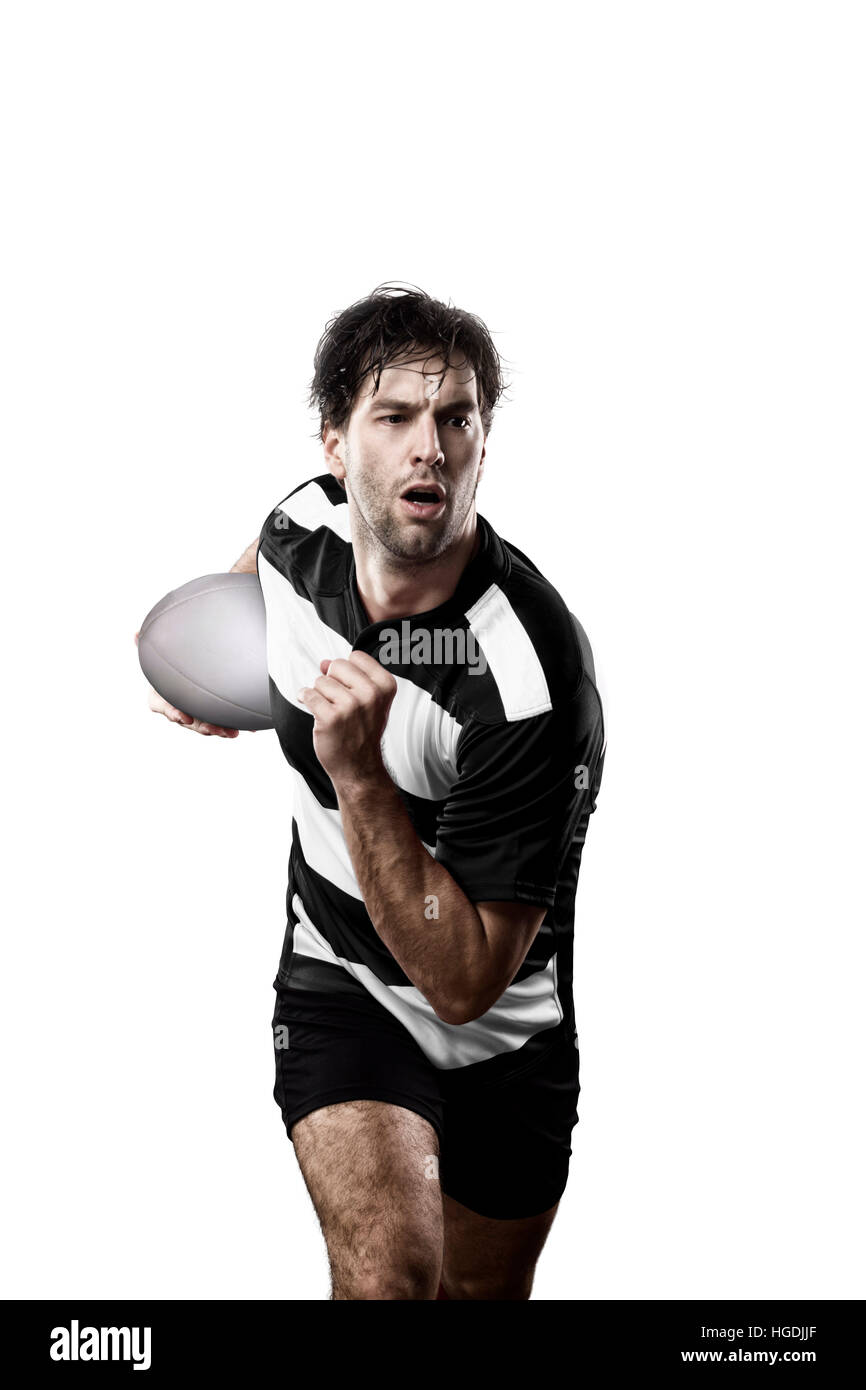 Rugby player in a black and white uniform running. White Background ...