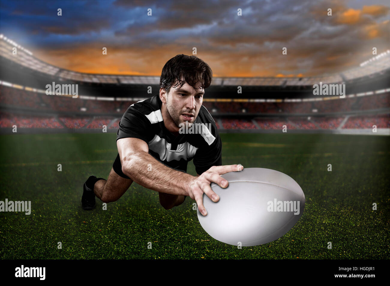 Rugby player in a black and white uniform on a stadium Stock Photo - Alamy