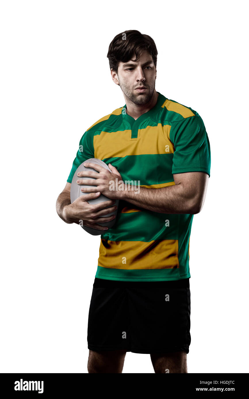 Rugby player in a green and gold uniform. White Background Stock Photo ...
