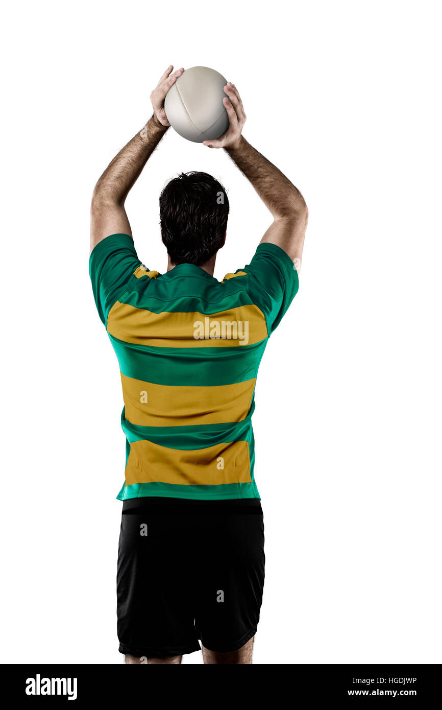 Rugby player in a green and gold uniform. White Background Stock Photo ...