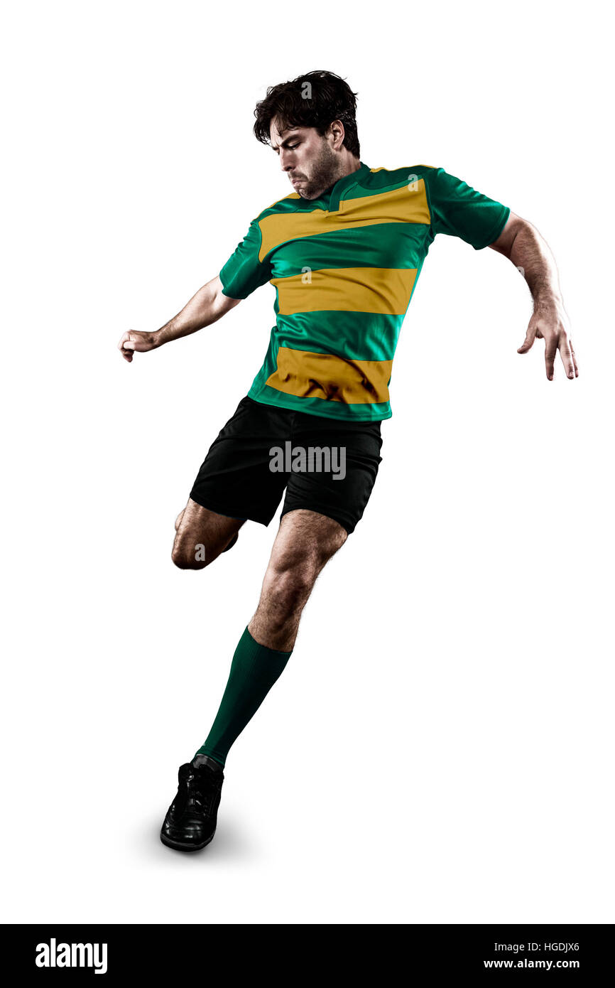 Rugby player in a green and gold uniform kicking. White Background ...
