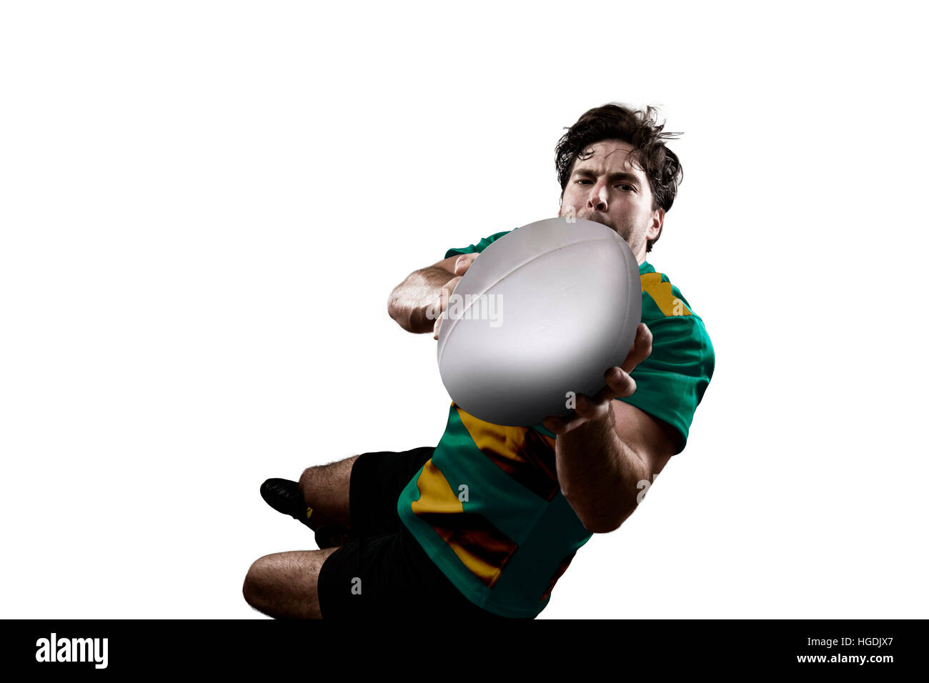 Rugby player in a green and gold uniform. White Background Stock Photo ...