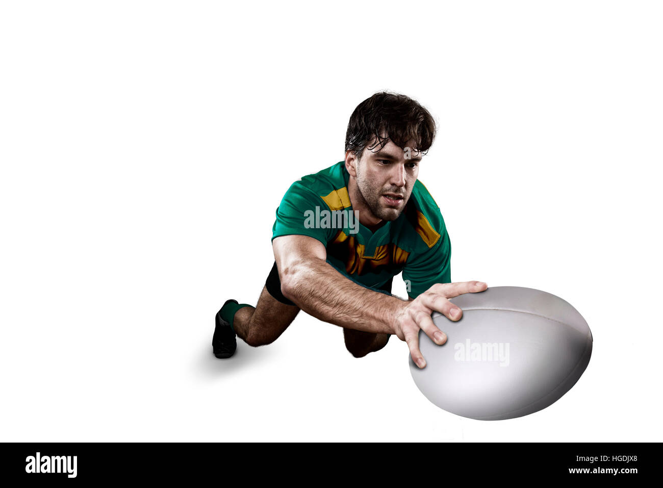 Rugby player in a green and gold uniform. White Background Stock Photo ...