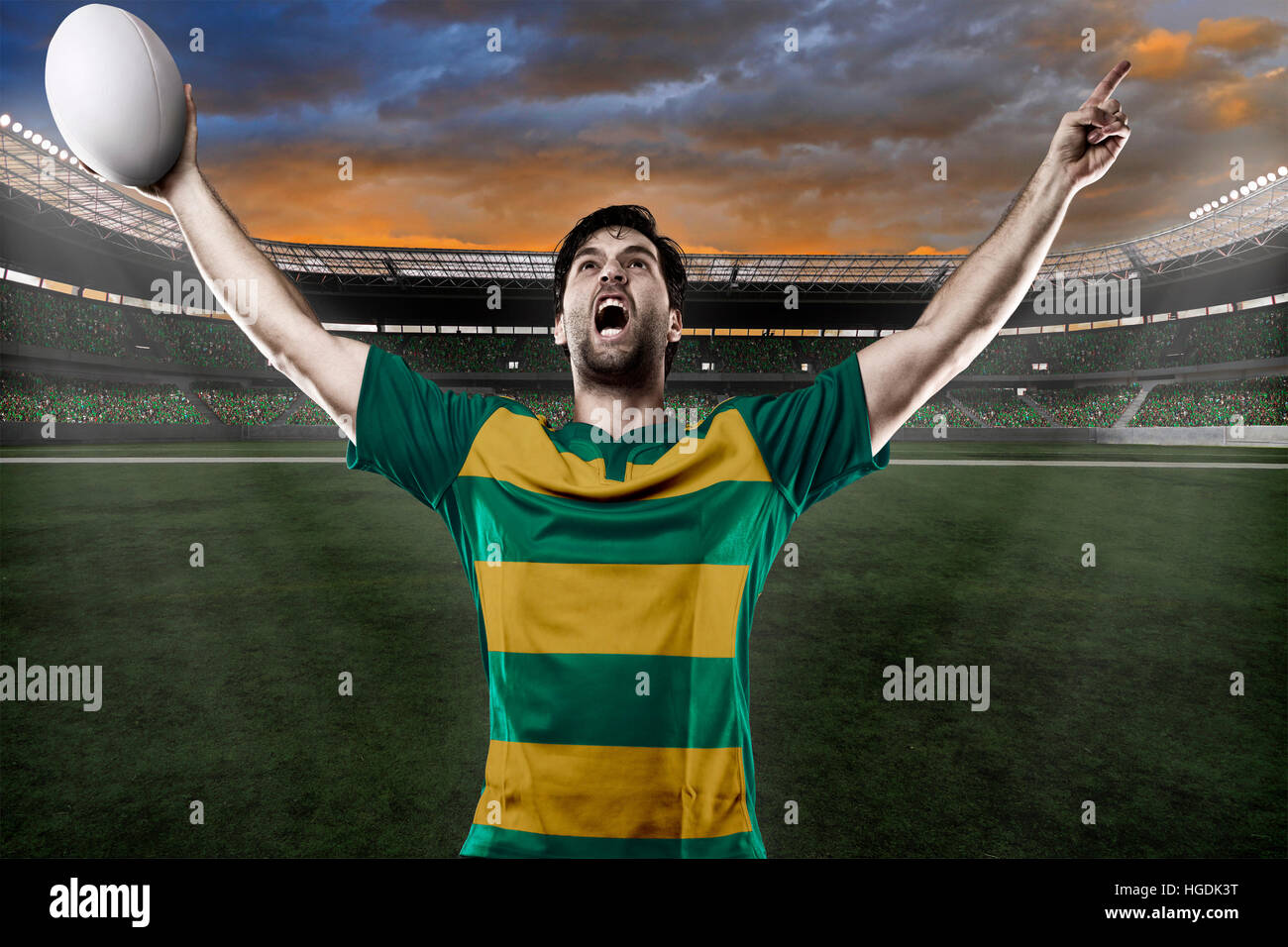 Rugby player in a green and gold uniform celebrating on a stadium Stock ...