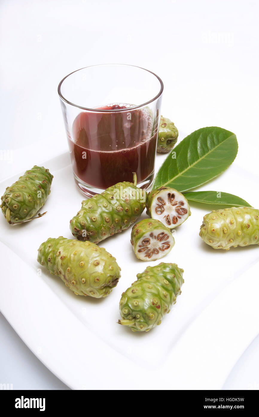 Noni juice and fresh noni fruit Stock Photo - Alamy
