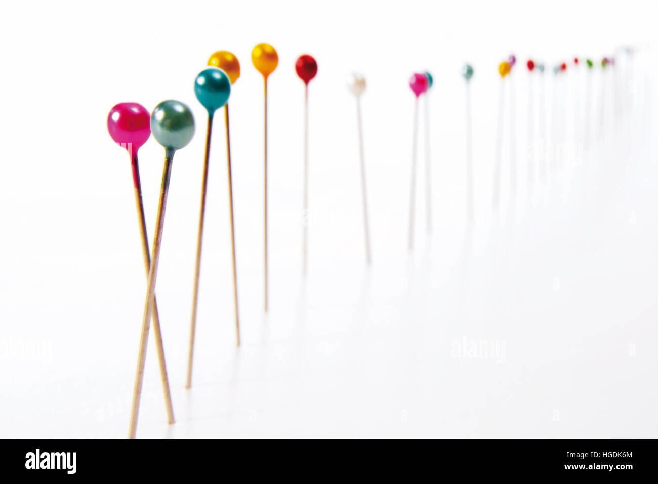 Fixing pins standing in a row Stock Photo - Alamy