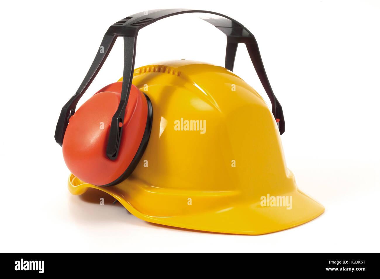 Yellow construction helmet with ear defenders Stock Photo - Alamy