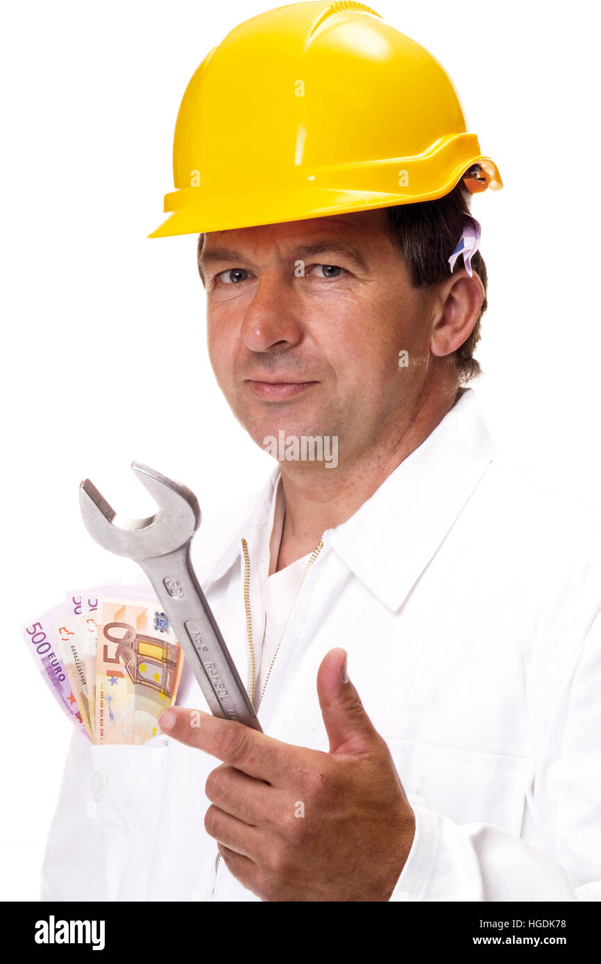 Mechanic wearing yellow construction helmet and open-end wrench, Euro ...
