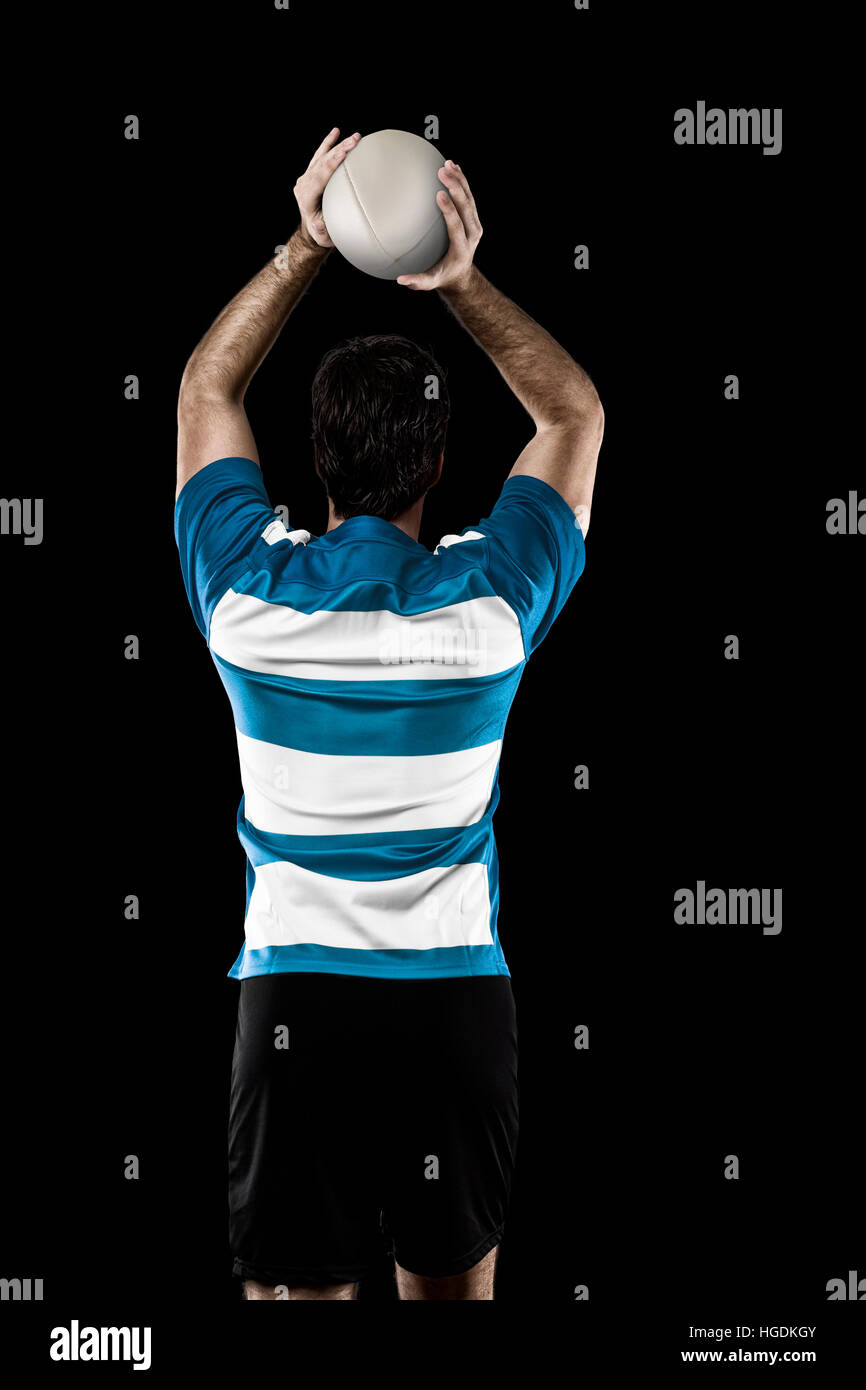 Rugby player in a blue uniform. black Background Stock Photo - Alamy