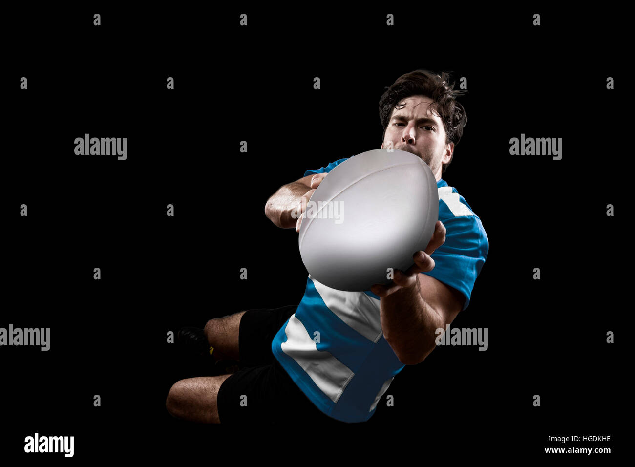 Rugby player in a blue uniform. black Background Stock Photo - Alamy