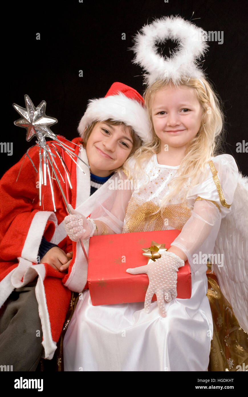 Children as Santa Claus and christ child Stock Photo - Alamy