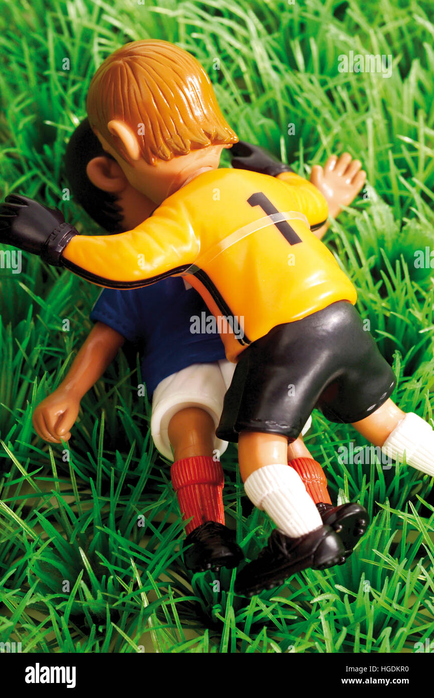 Two football players lying top hi-res stock photography and images - Alamy